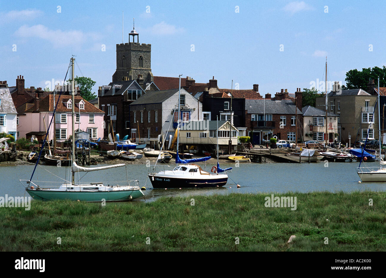 Small port with brightly painted wood and brick cottages on the River ...