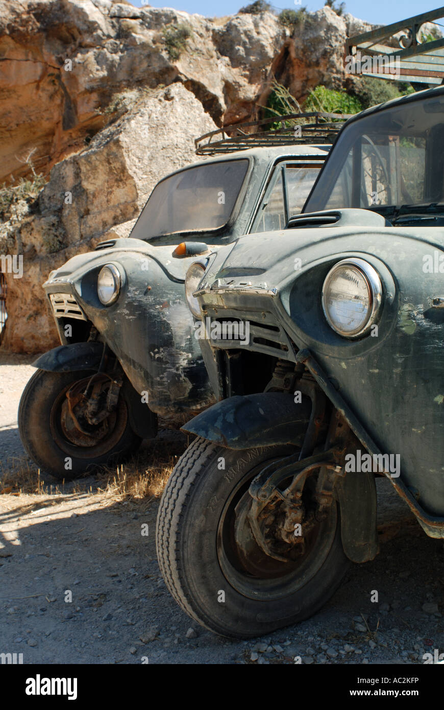 Two worn-down Mazda T1500 three-wheel trucks (high DOF Stock Photo - Alamy