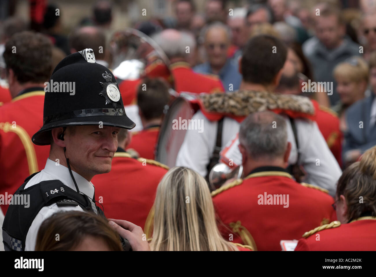 A Happy Policeman watching a parade Stock Photo - Alamy
