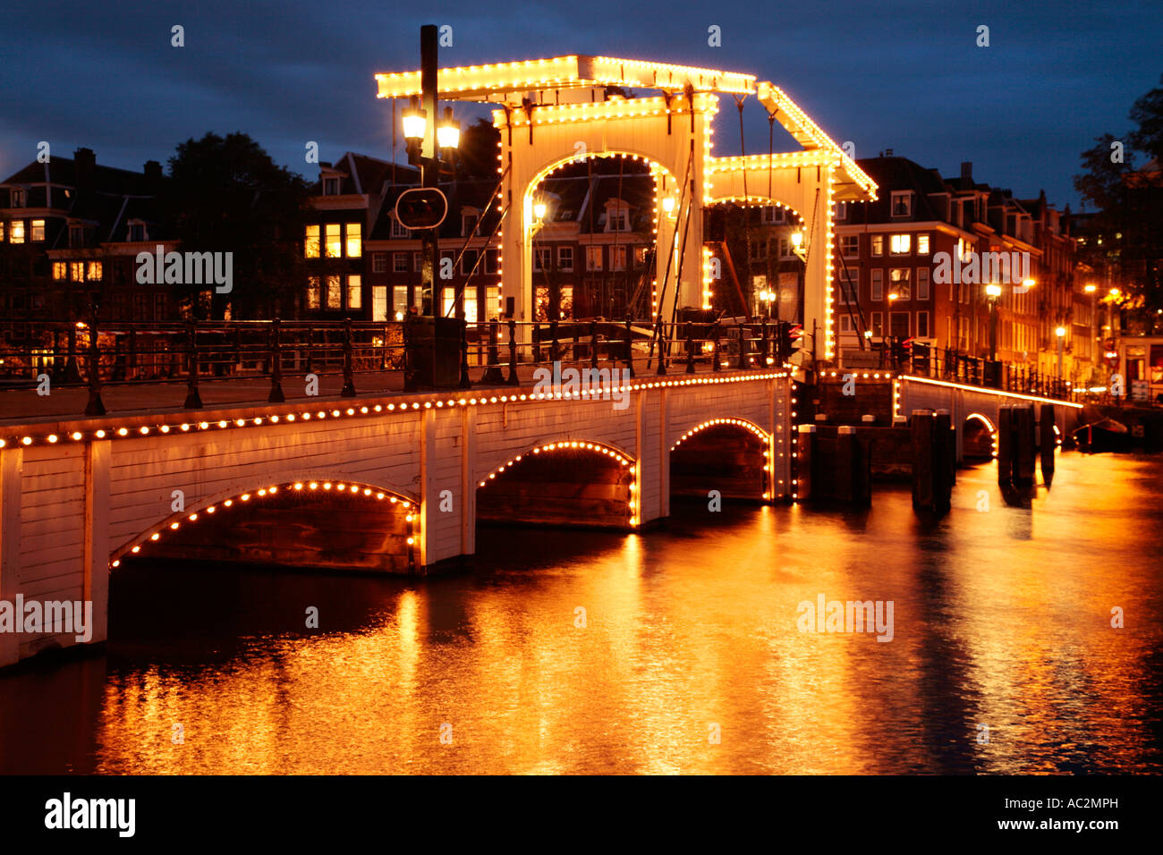 illuminated Magere Brug (Narrow Bridge) in Amsterdam in The Netherlands ...