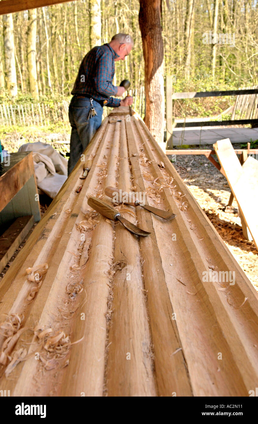 Wood carver working on a rood screen for the reconstruction of the 13th ...
