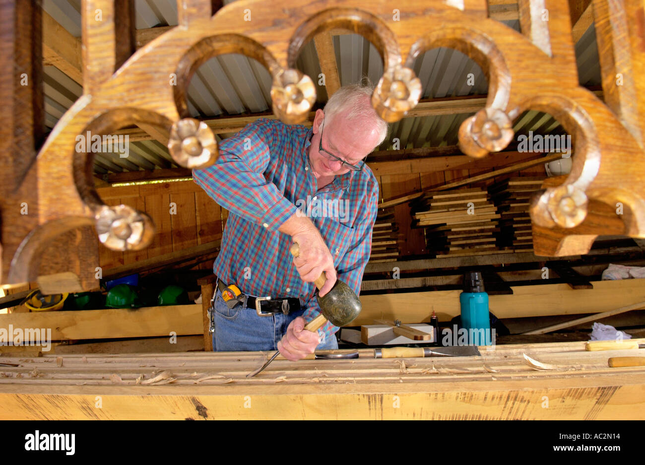 Wood carver working on a rood screen for the reconstruction of the 13th ...