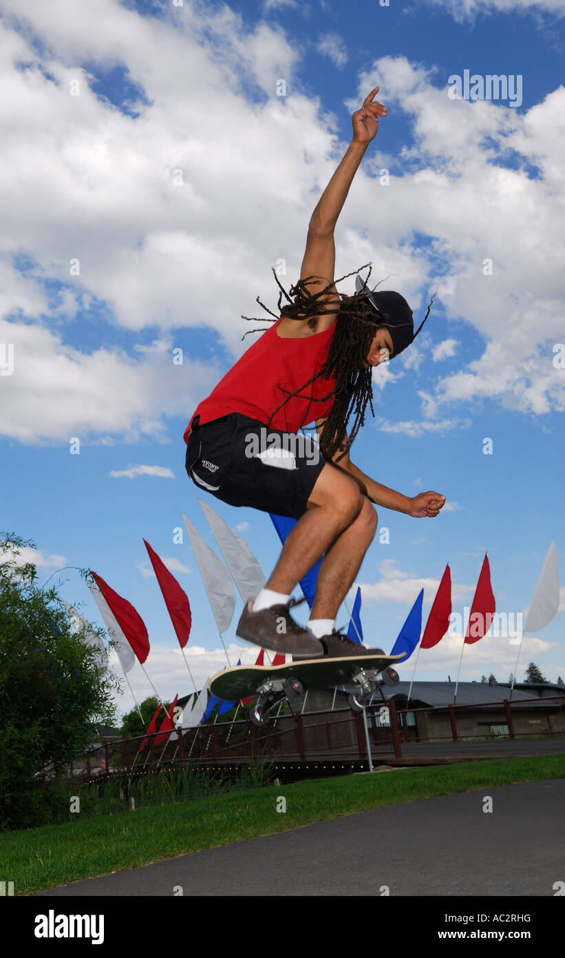 Black male skateboarder with dreadlocks getting air Bend Oregon USA ...