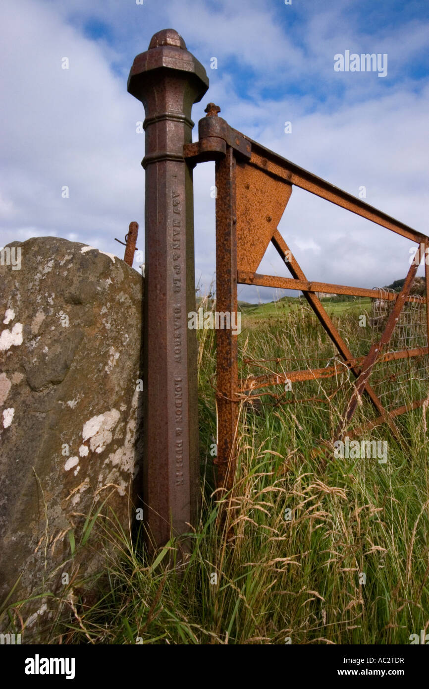 Old rusting cast iron gatepost and gate by A&J Main on Mull, Scotland ...
