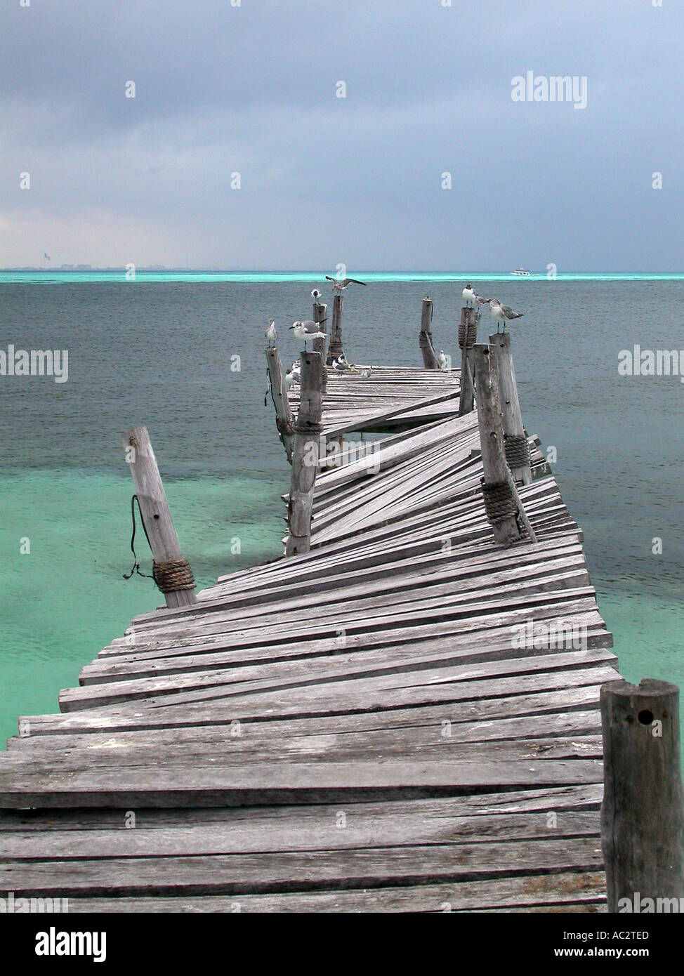 Crooked Broken Dock on Gulf of Mexico Isla Mujeres Stock Photo - Alamy