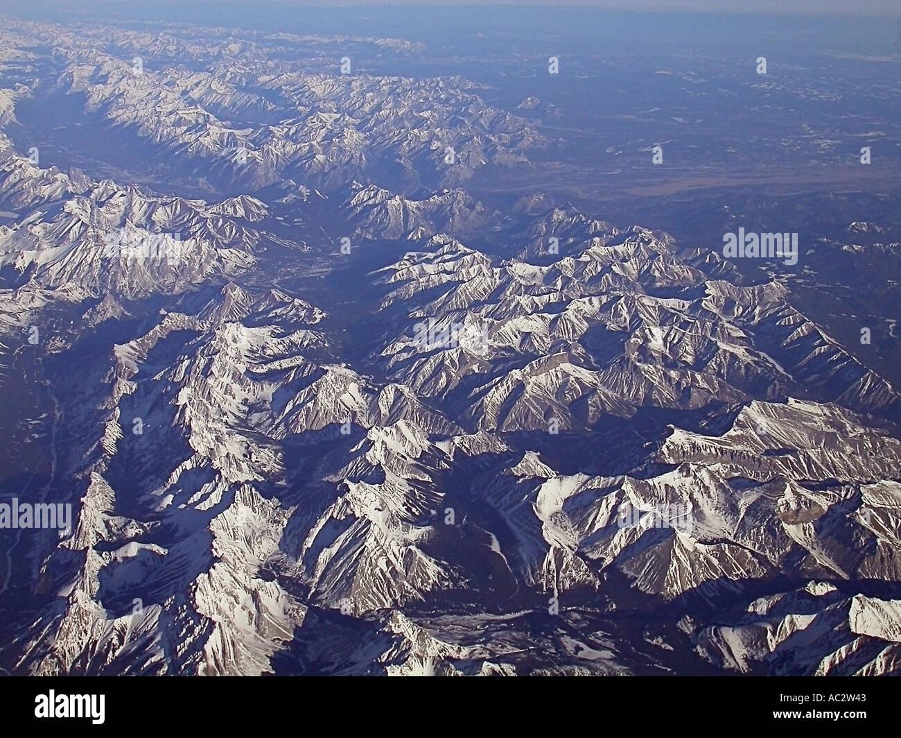 Eastern Rocky Mountains and Alberta foothills from air Stock Photo - Alamy