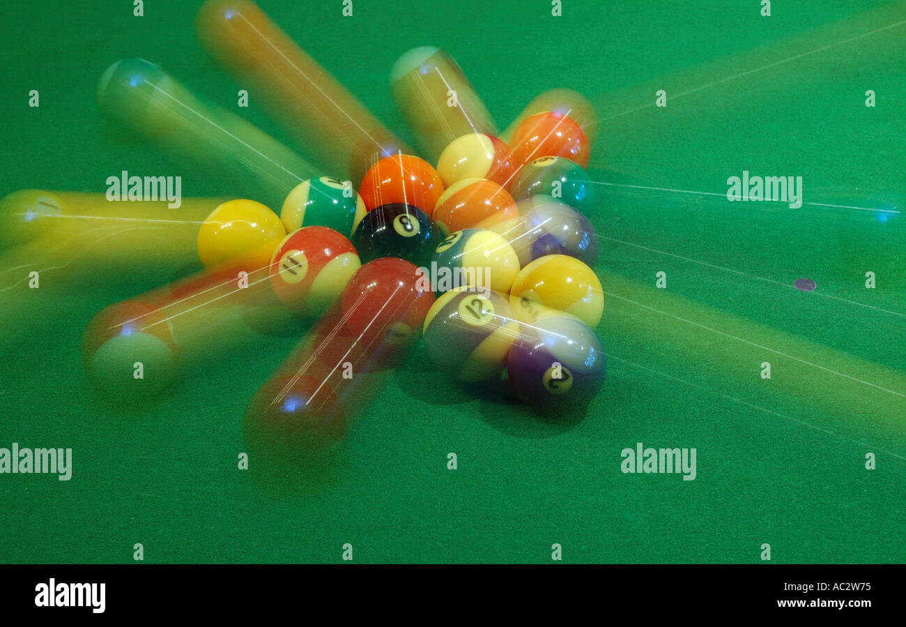 Blurred billiard balls after an even pool break Stock Photo - Alamy