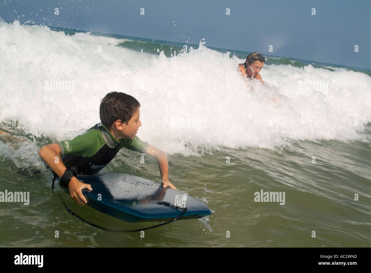 Surfers surfer boys kids surfboard hi-res stock photography and images ...