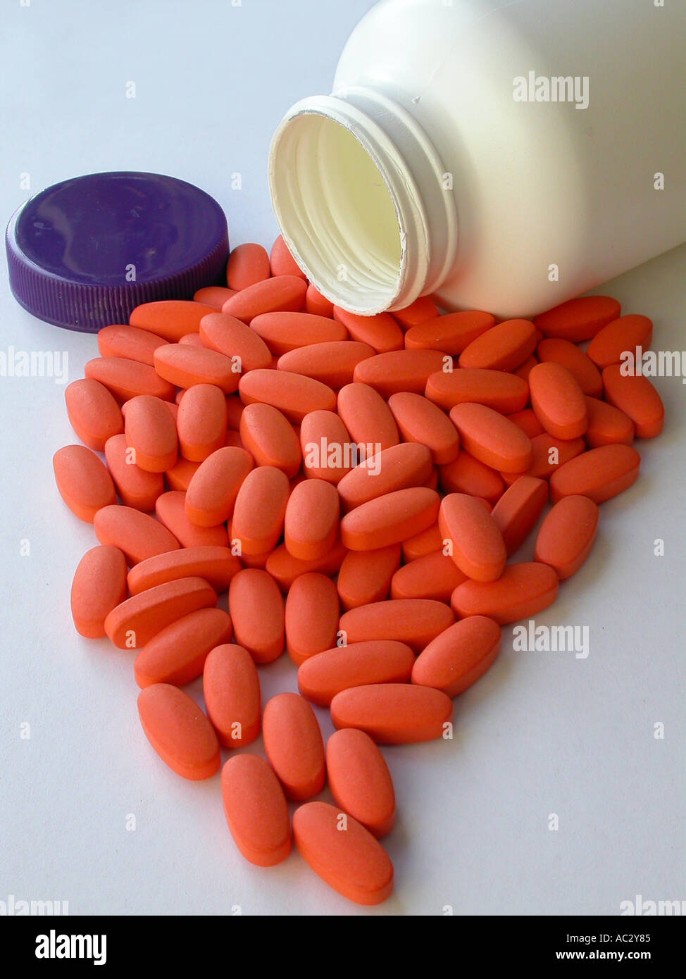 spilled Medicine tablets from bottle portrait Stock Photo - Alamy