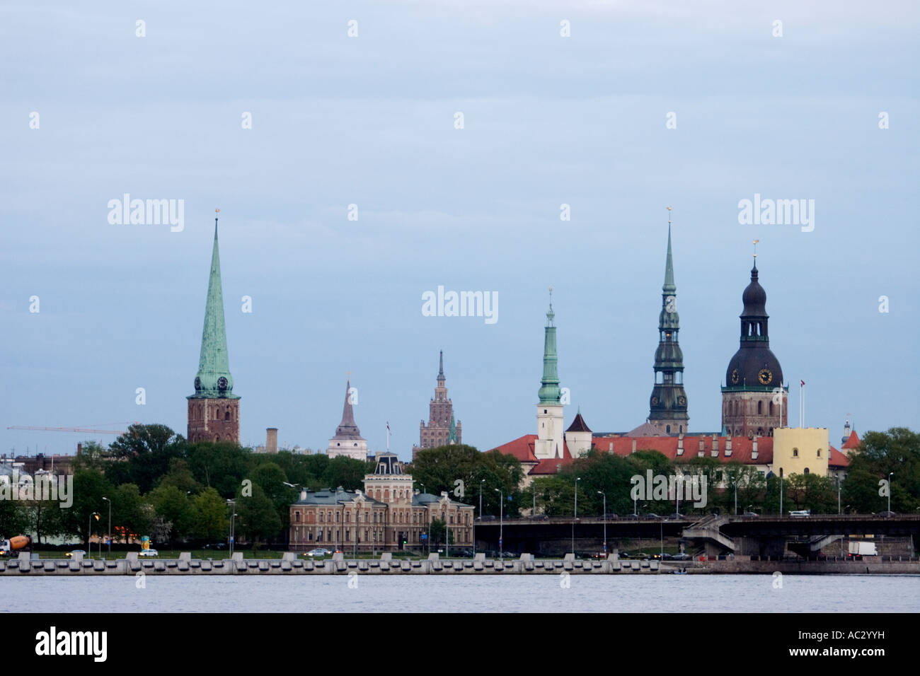 The view of St. Peters Church and bridge from the river Riga Latvia ...