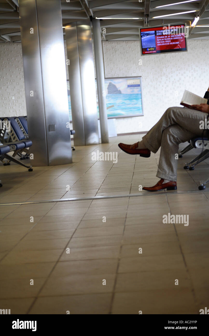 Man waiting in airport, Turkey Stock Photo - Alamy