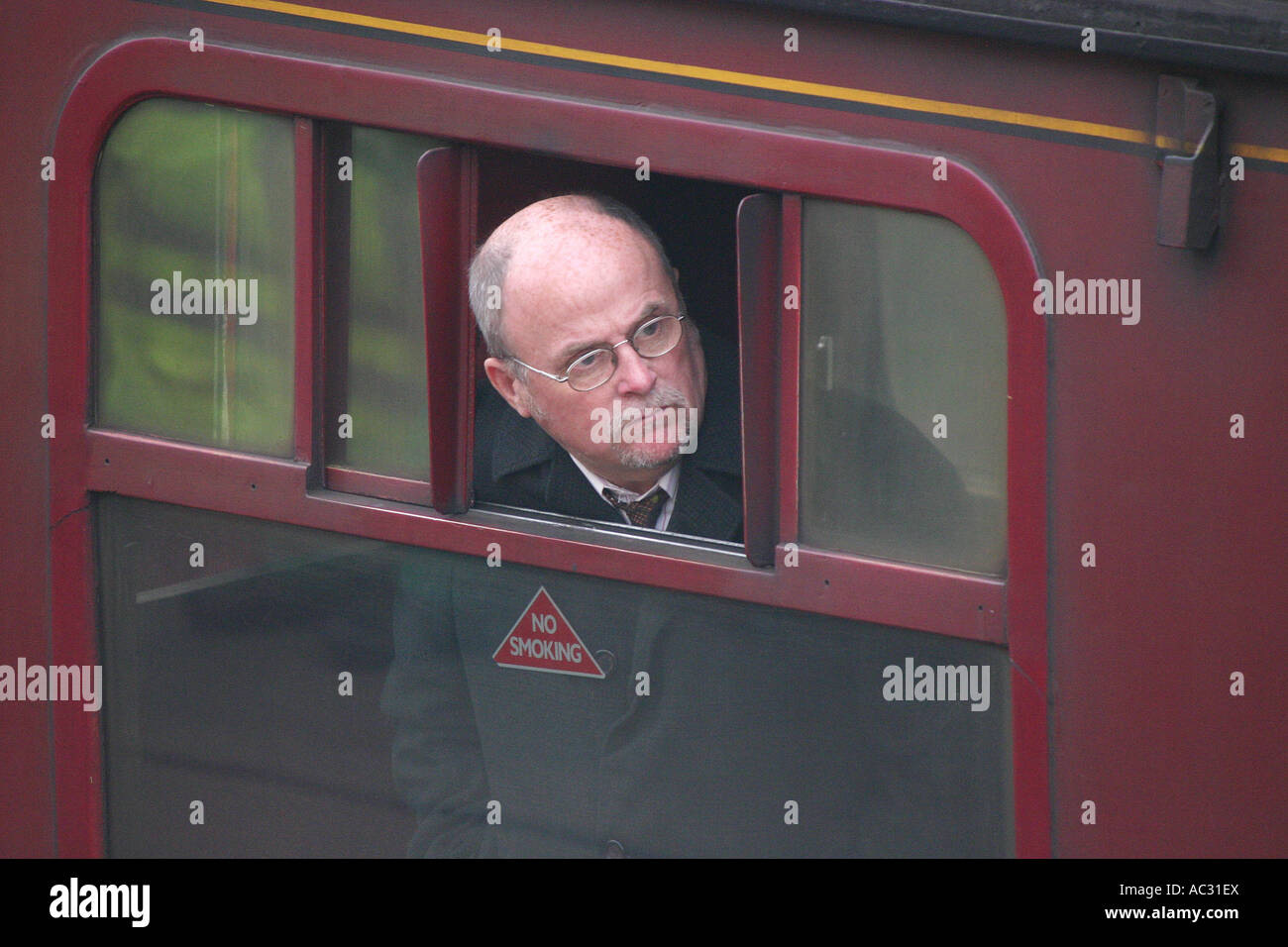 Extra actor looking out of carriage window at Goathland station on the ...