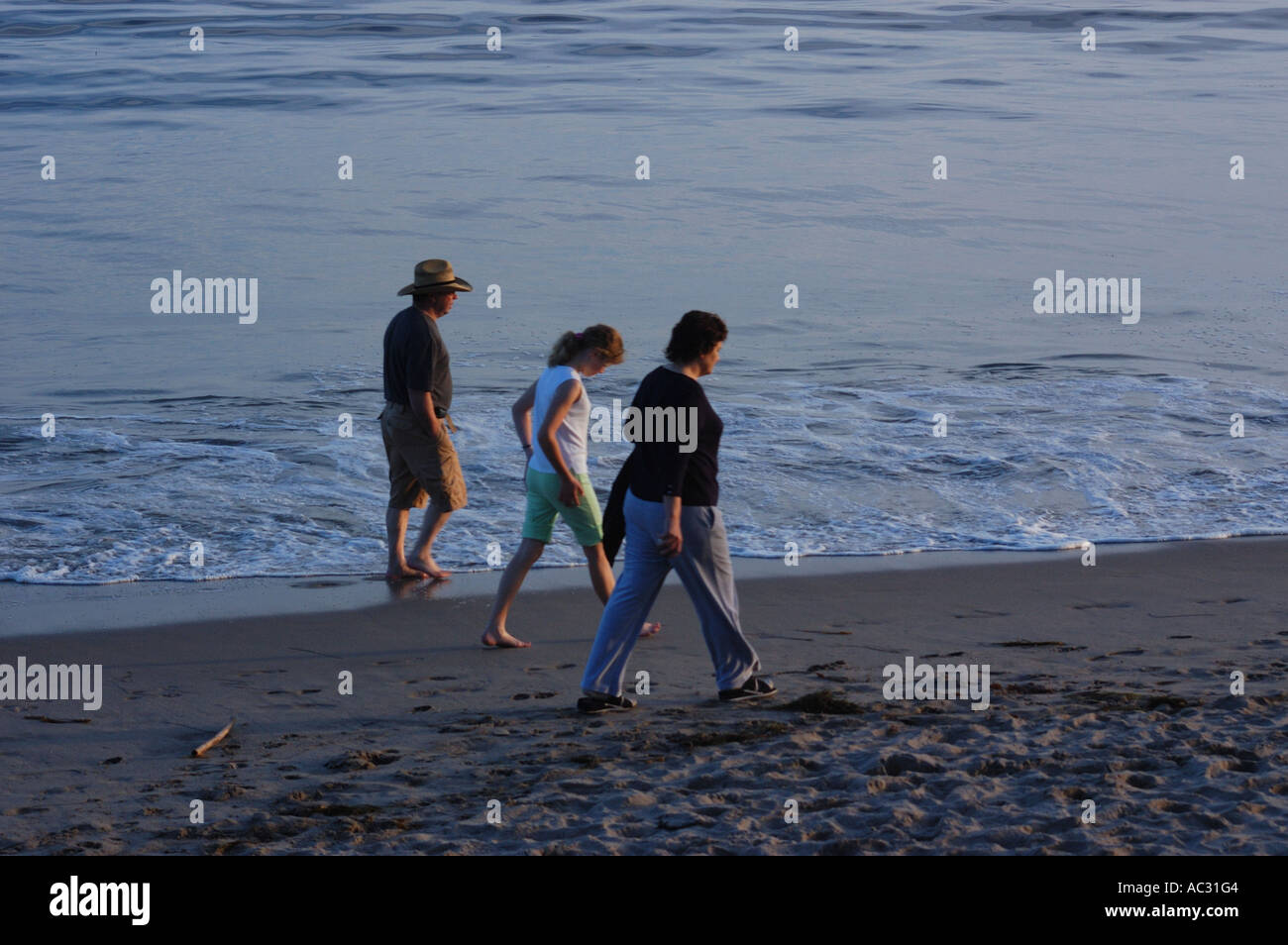 People Walking on Beach Stock Photo - Alamy