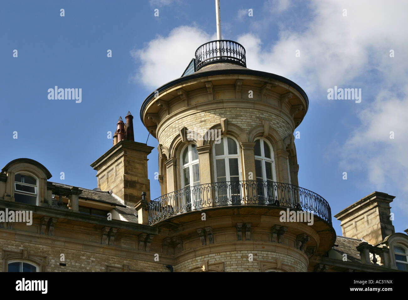 Round turret structure on building with elongated windows Stock Photo ...