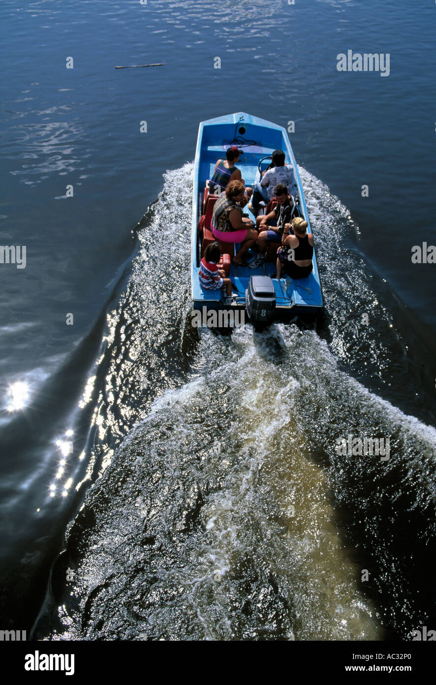 tourists in motor boat traveling along a cuban waterway Stock Photo - Alamy
