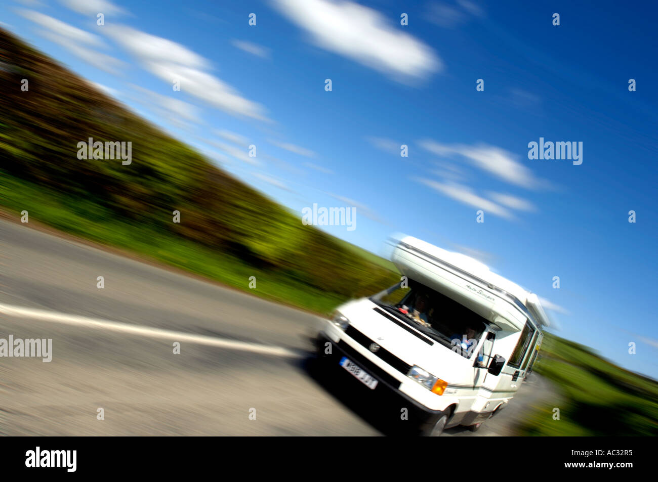 A camper van cruises through the British countryside Stock Photo - Alamy