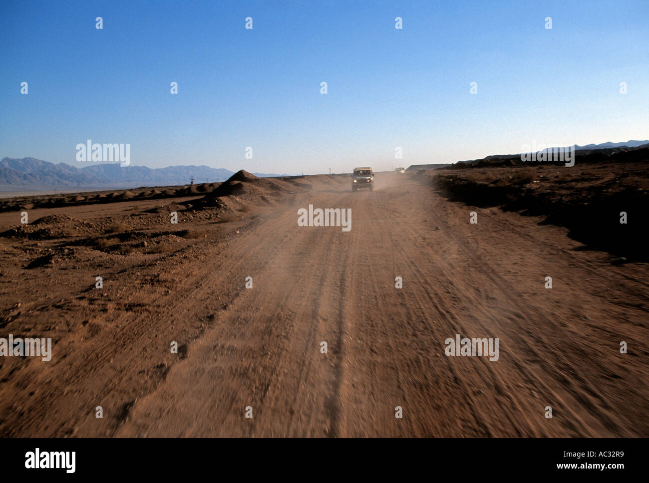dusty track on the arabian desert Stock Photo - Alamy