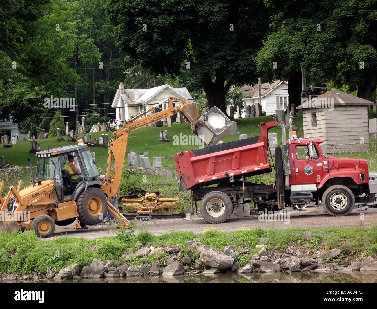 Backhoe loading truck Stock Photo - Alamy