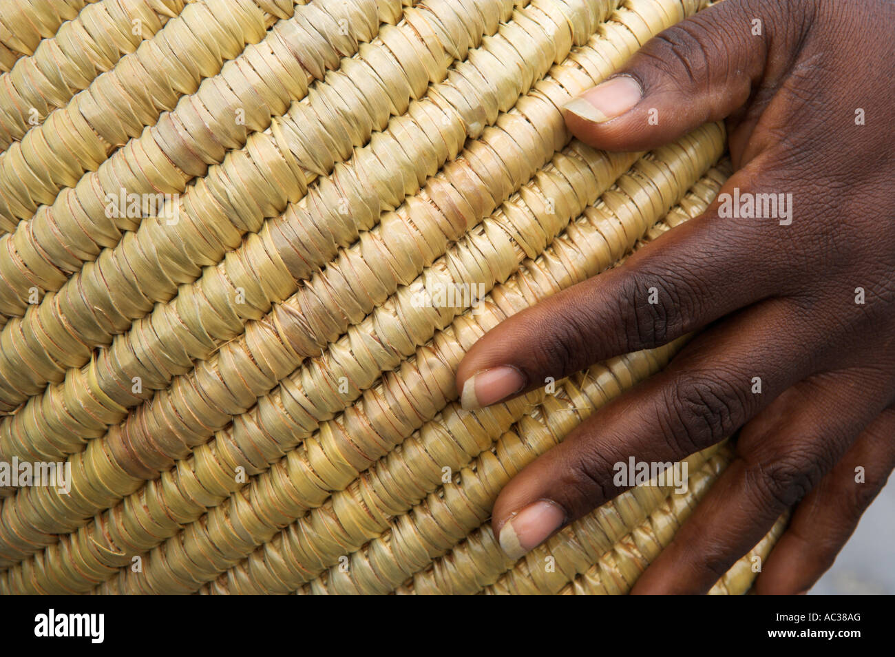 Closeup of hand holding straw basket Stock Photo - Alamy