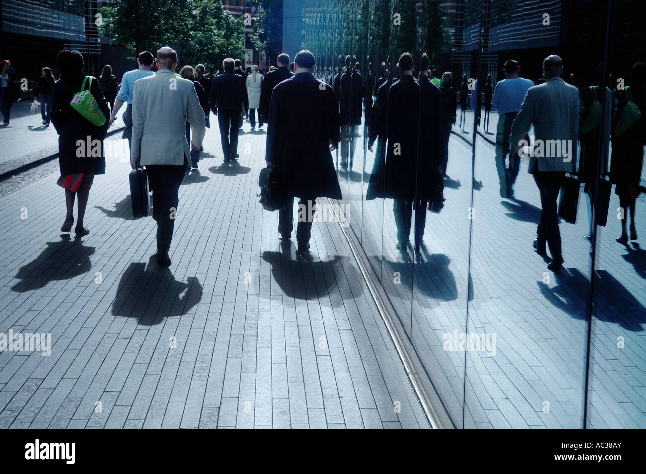 businessmen and women walking home from work in London UK Stock Photo ...