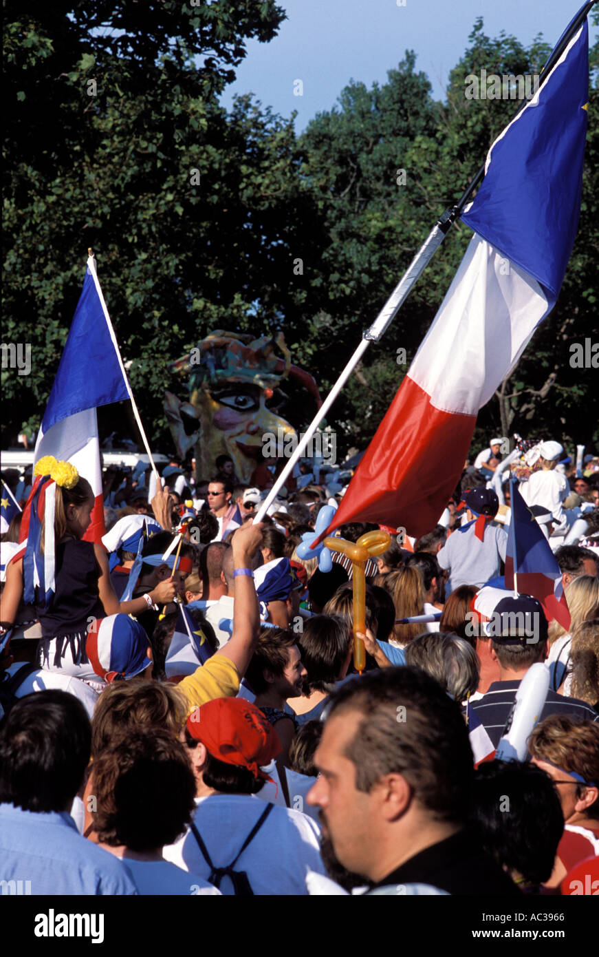 Tintamarre Festival with Acadien Flags Stock Photo - Alamy