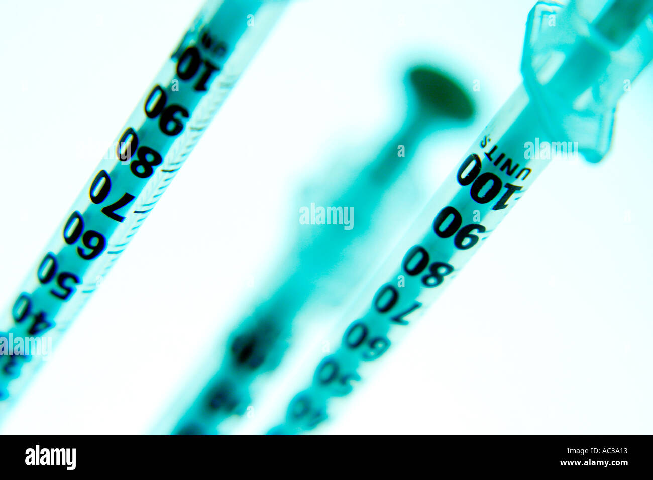 Abstract colourful syringes with needles colour toned and selective ...