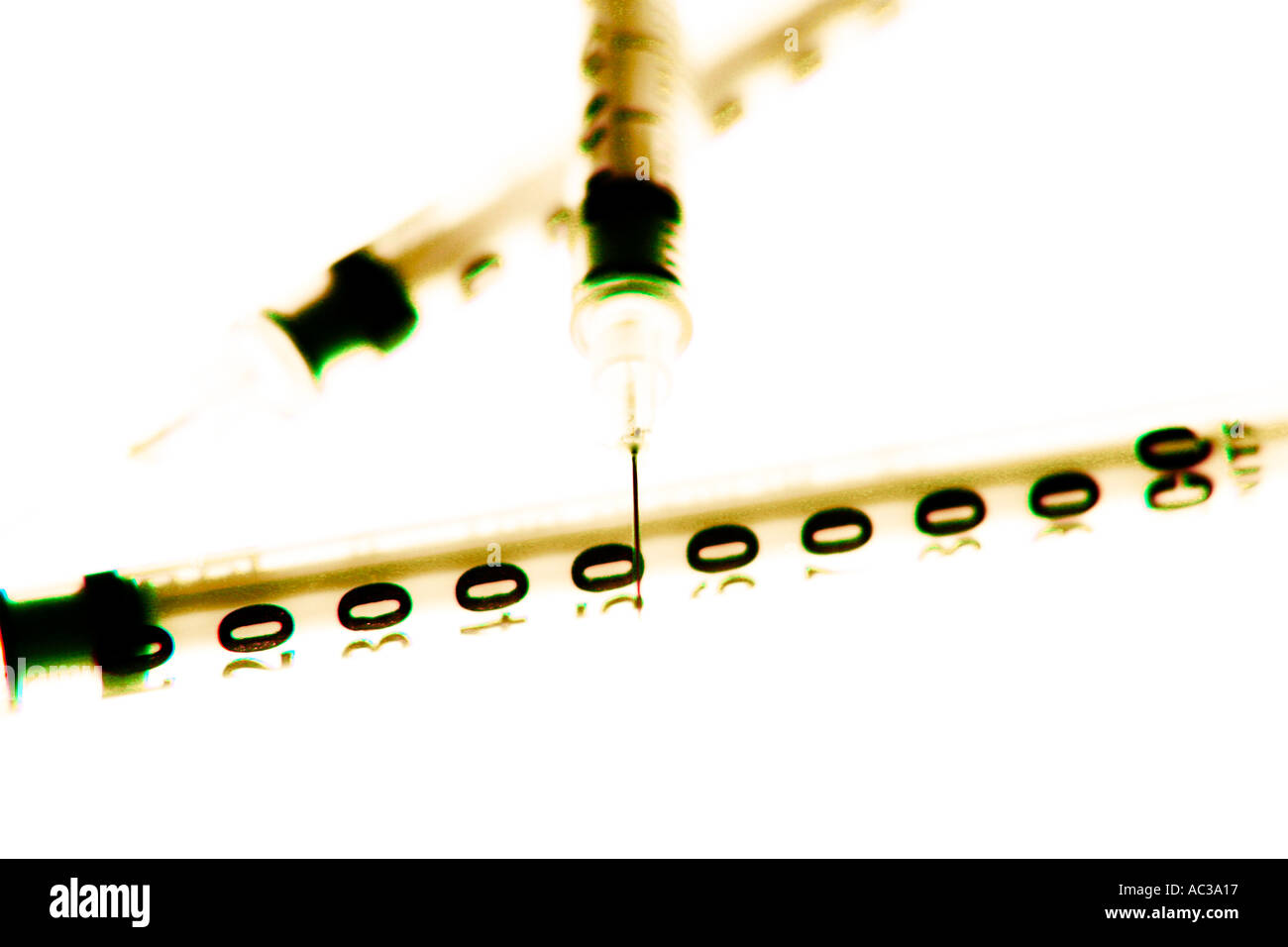 Abstract colourful syringes with needles colour toned and selective ...