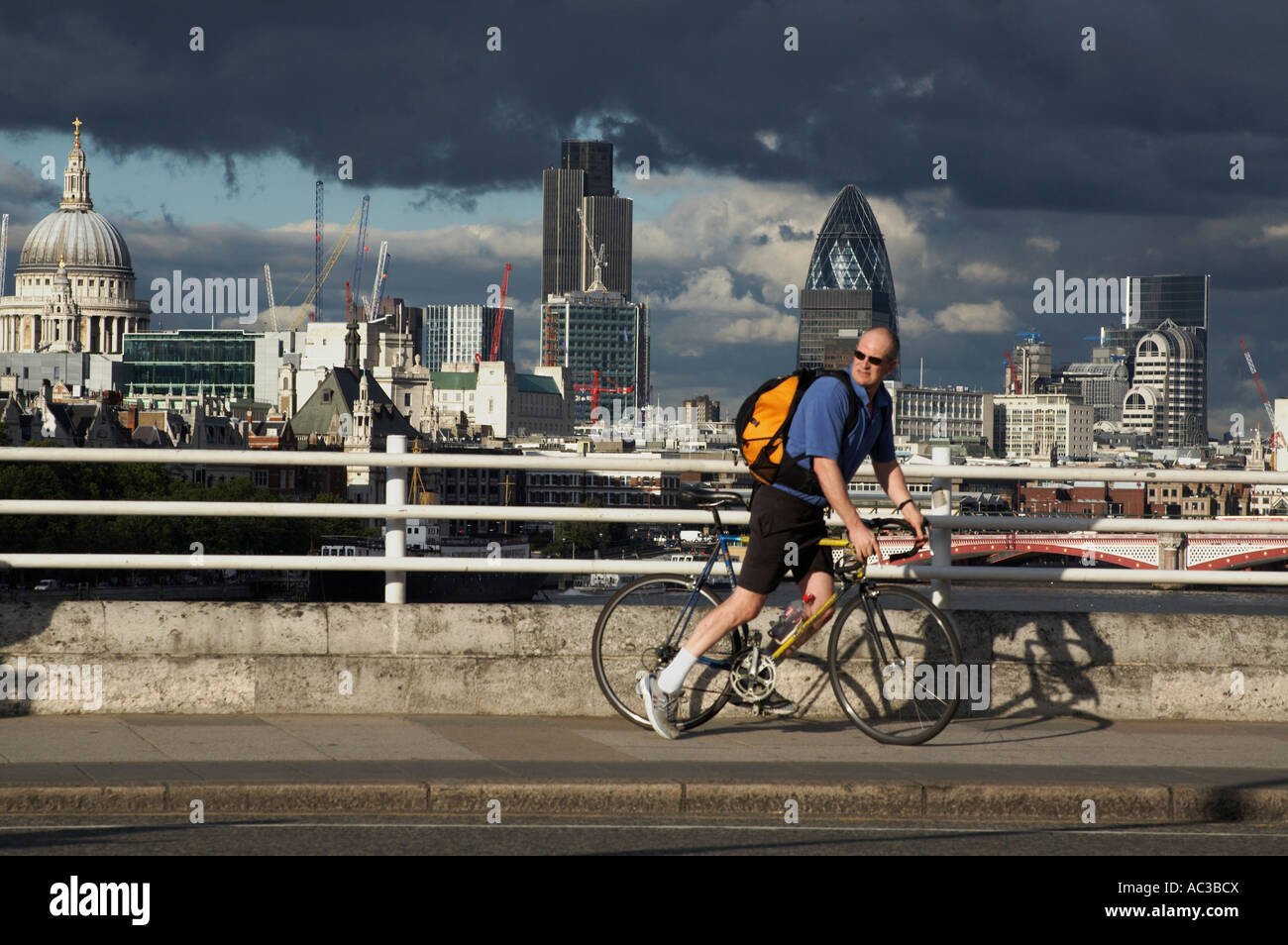 cyclist and City of London UK Stock Photo - Alamy
