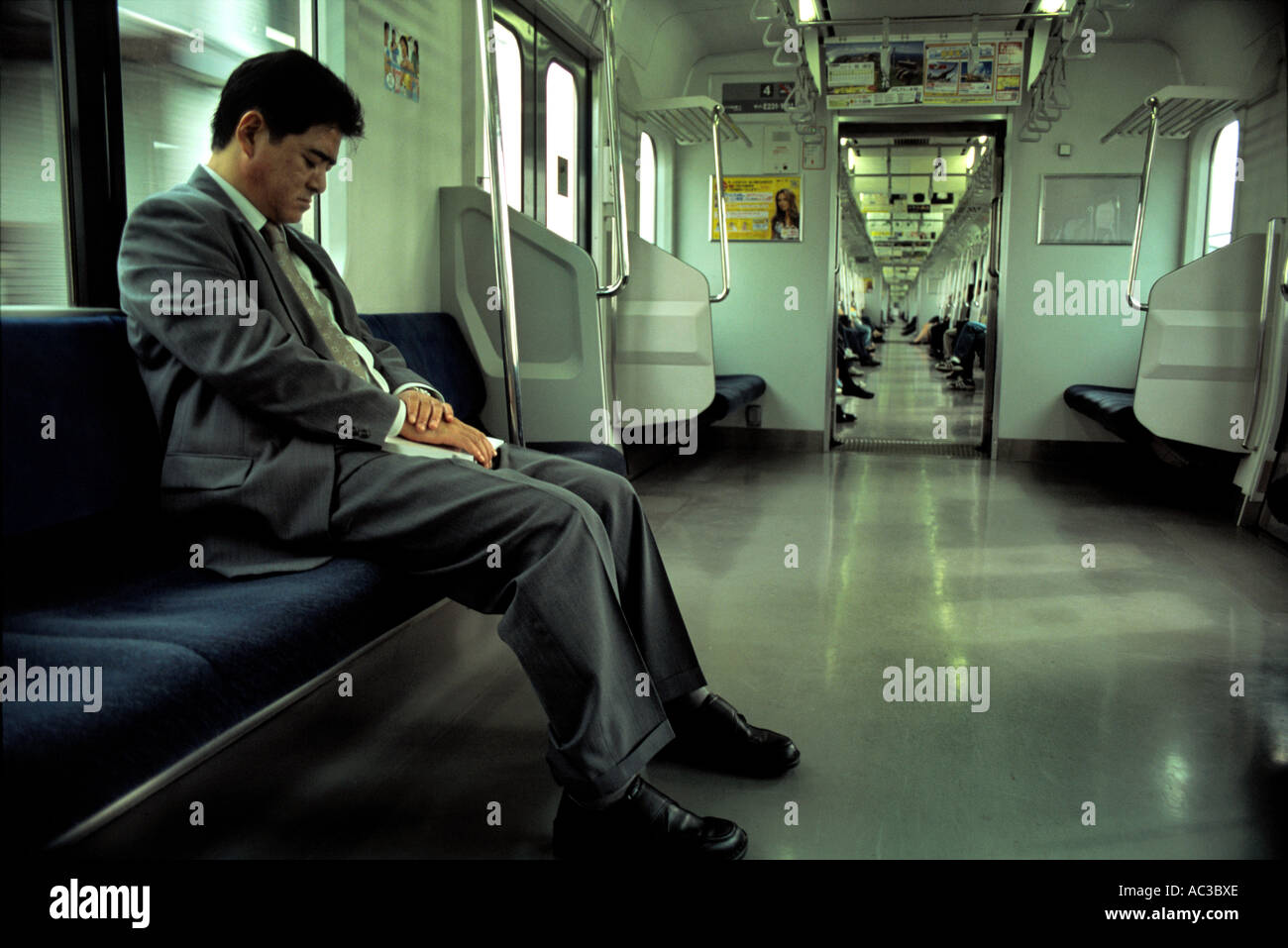 Man sleeping on the train hi-res stock photography and images - Alamy