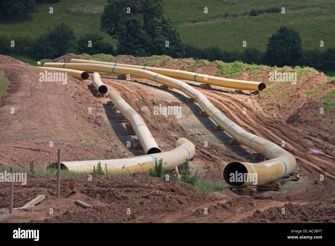 Laying new natural liquified gas pipeline through open countryside ...