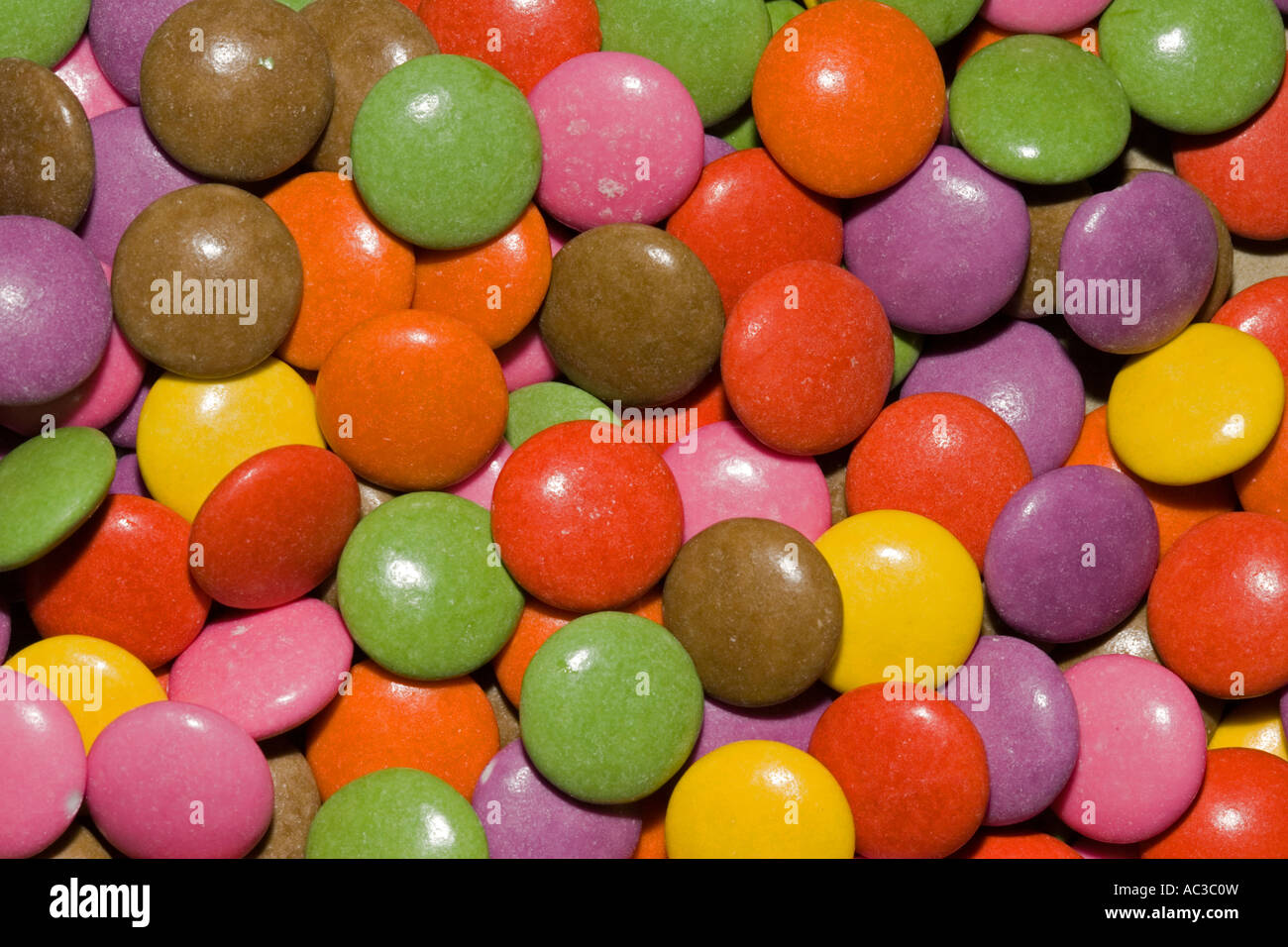 Closeup of group of colourful circular smarties UK Stock Photo - Alamy