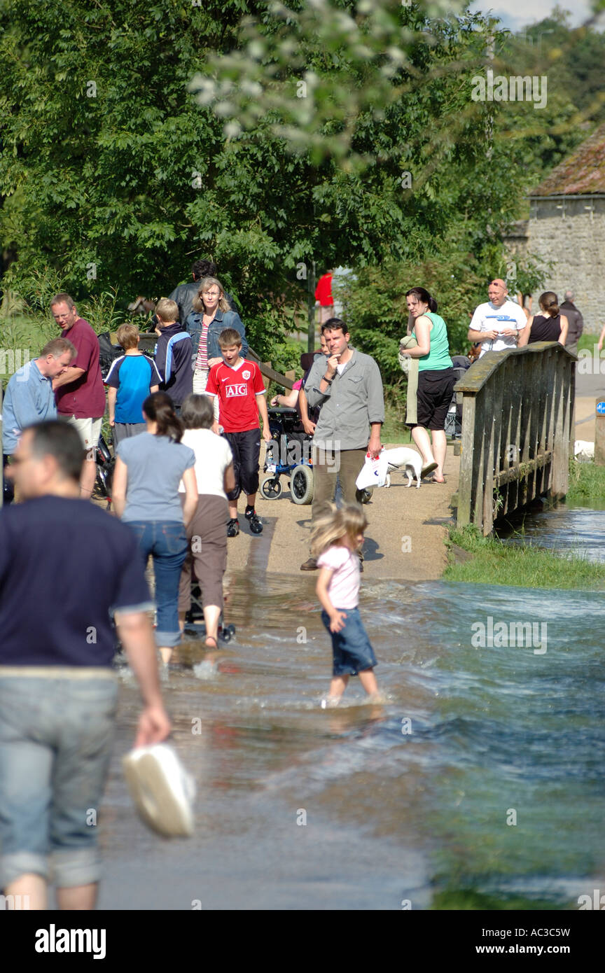 People out in the flood water Witney Stock Photo - Alamy