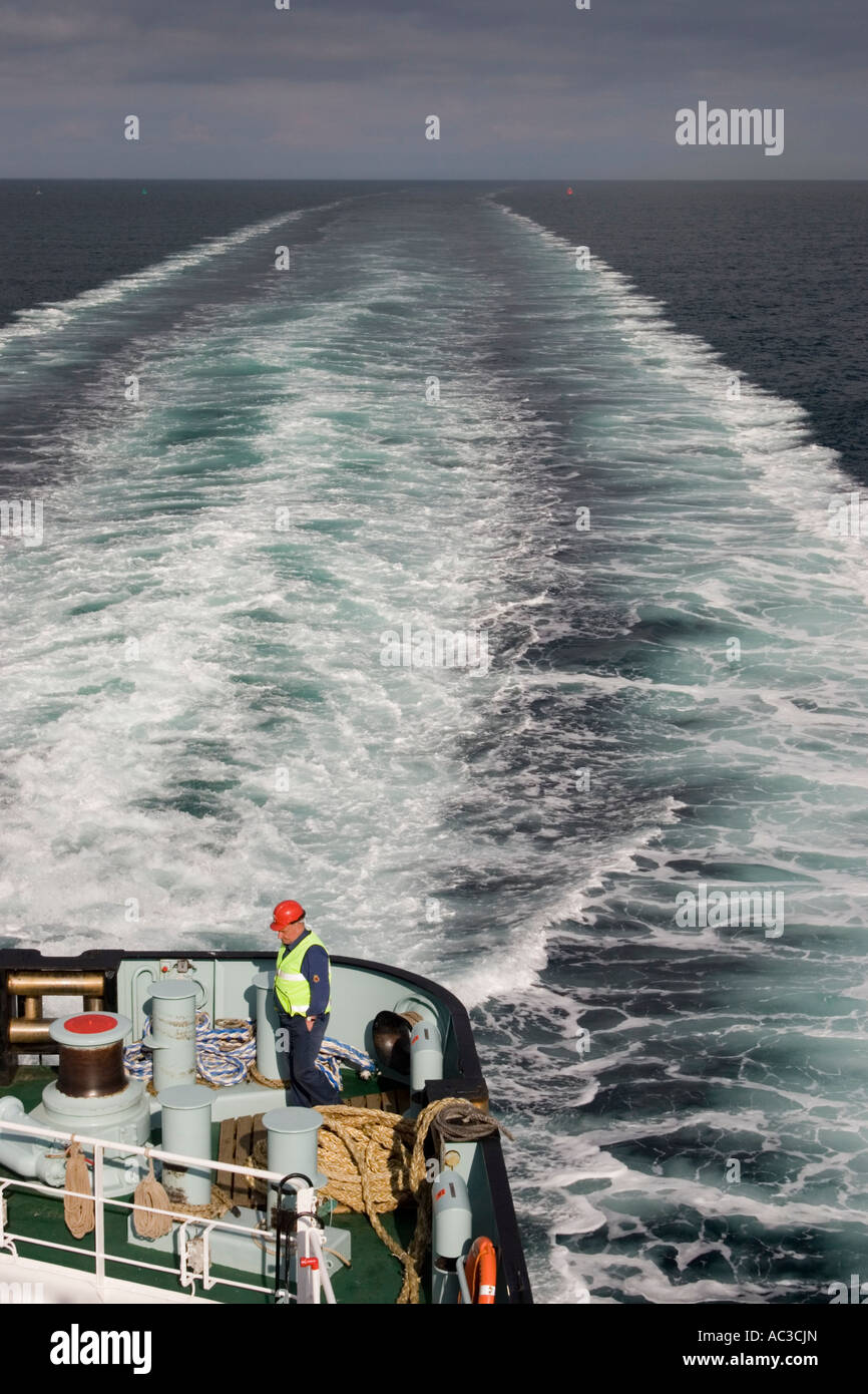 Stern and wake of Calmac Ferry from Oban to Barra with sailor Stock ...