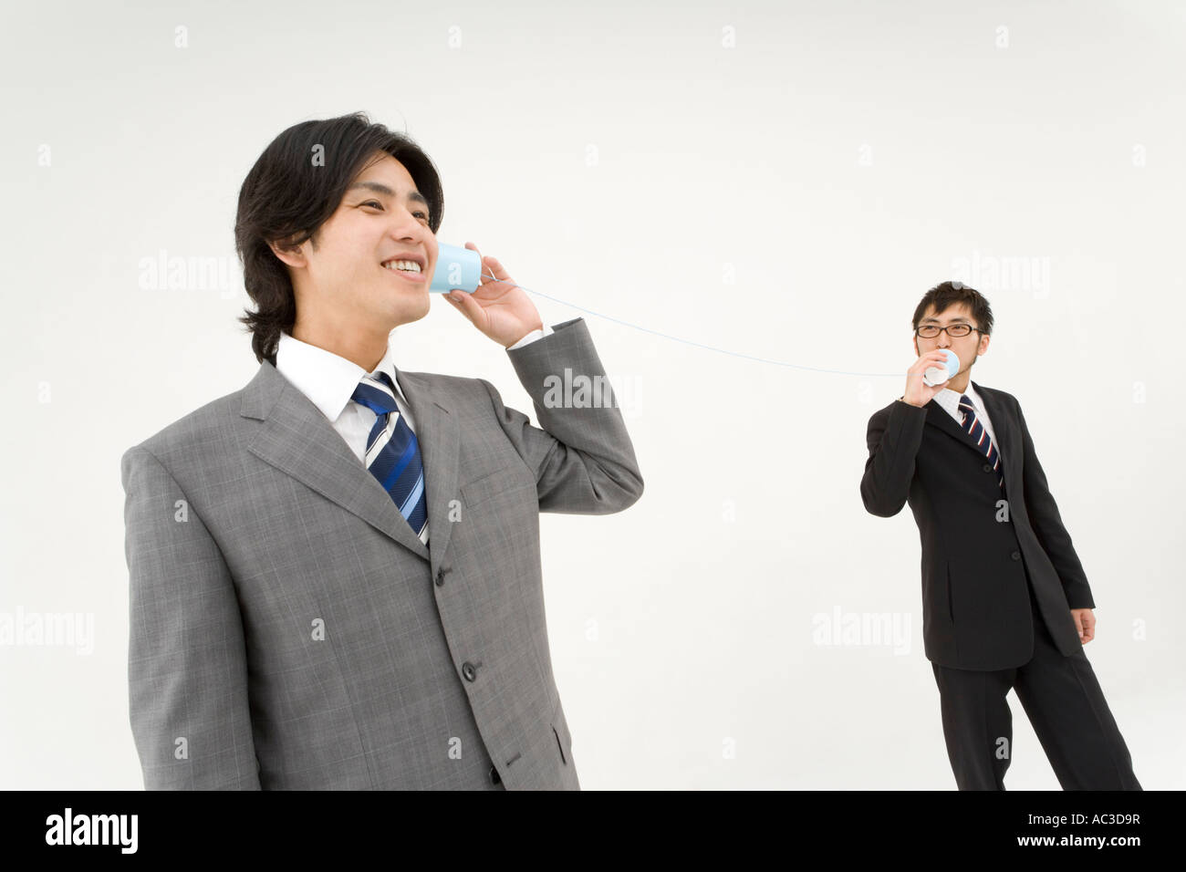 Businessmen talking string hi-res stock photography and images - Alamy