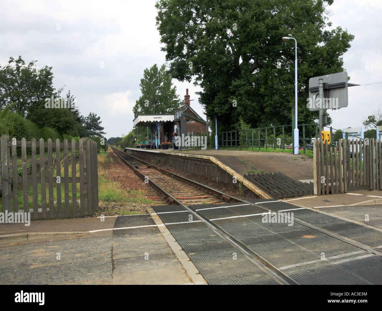 A view of the level crossing and railway station on the Bittern Line at ...