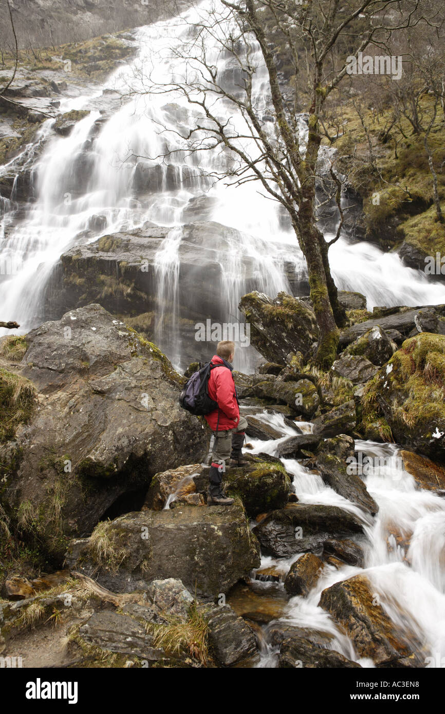 Hill walker at waterfall Stock Photo - Alamy