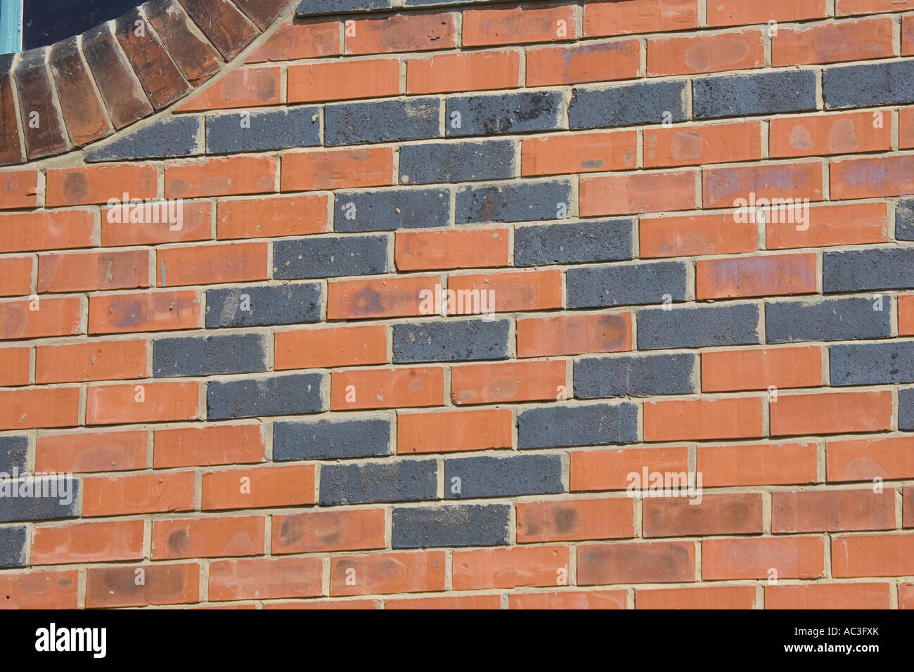 Blue bricks used to create pattern feature in red brick wall ...