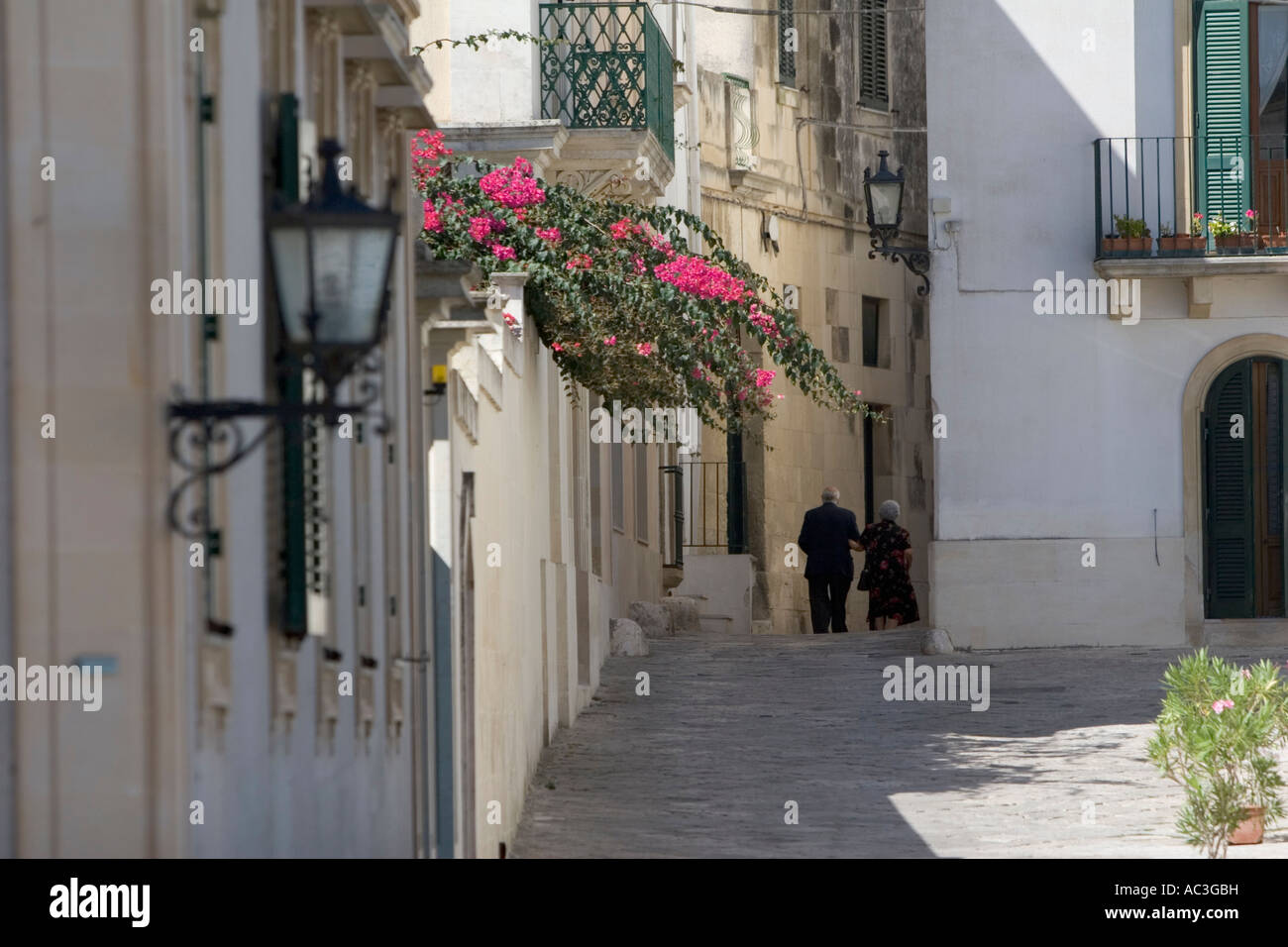 elderly couple on the street in Ótranto, Puglia, Italy Stock Photo - Alamy