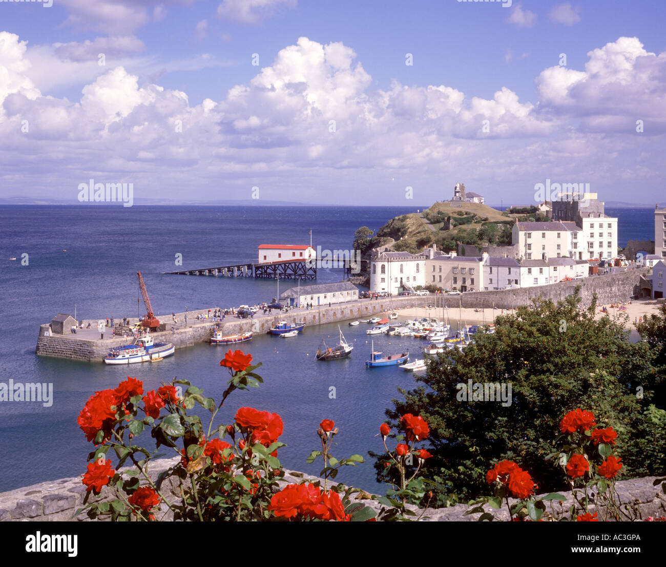 Tenby, Colourful view showing the harbour and Castle Hill Stock Photo ...