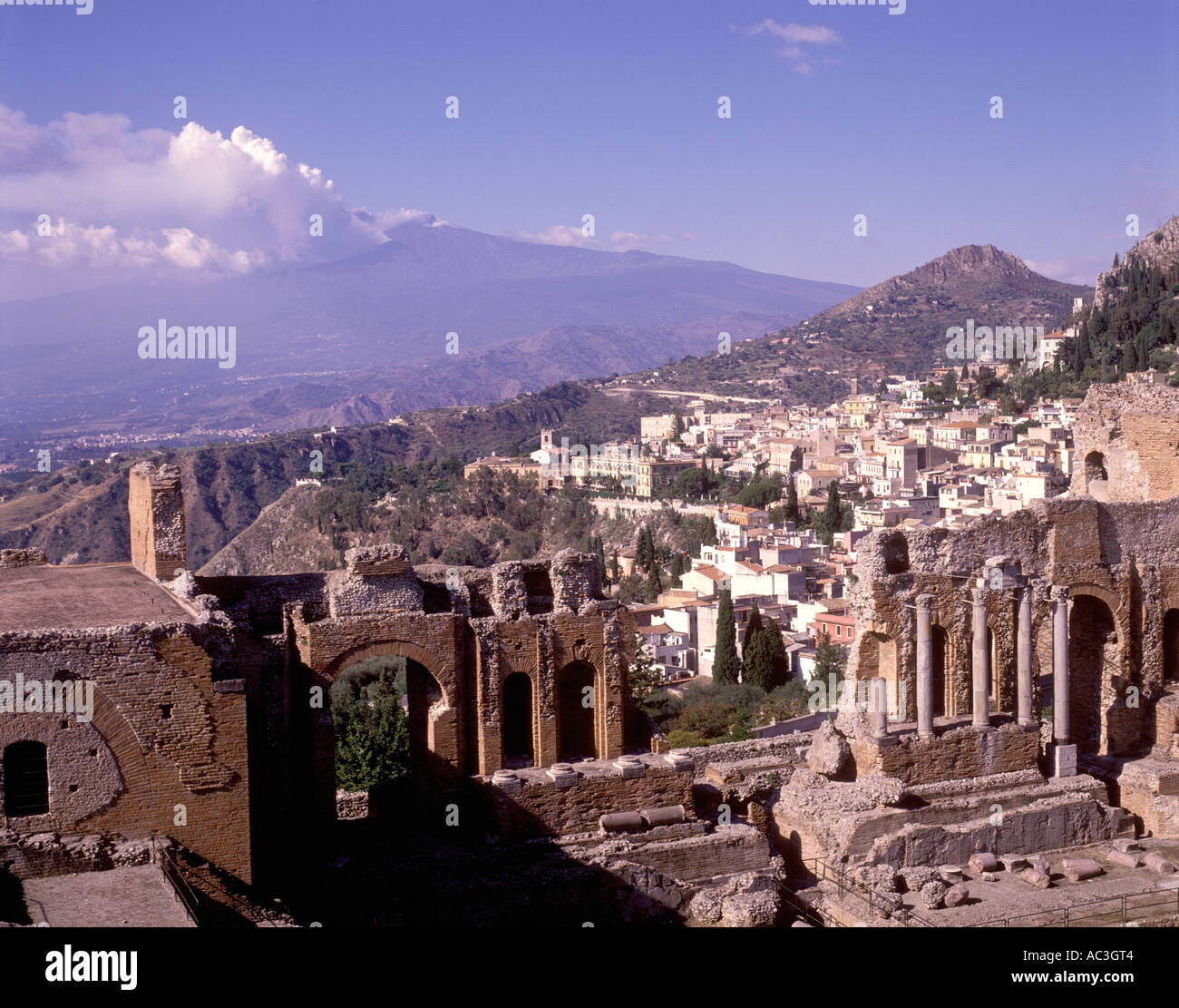 Taormina, Greco Roman Theatre with view of smoking Mount Etna Stock ...