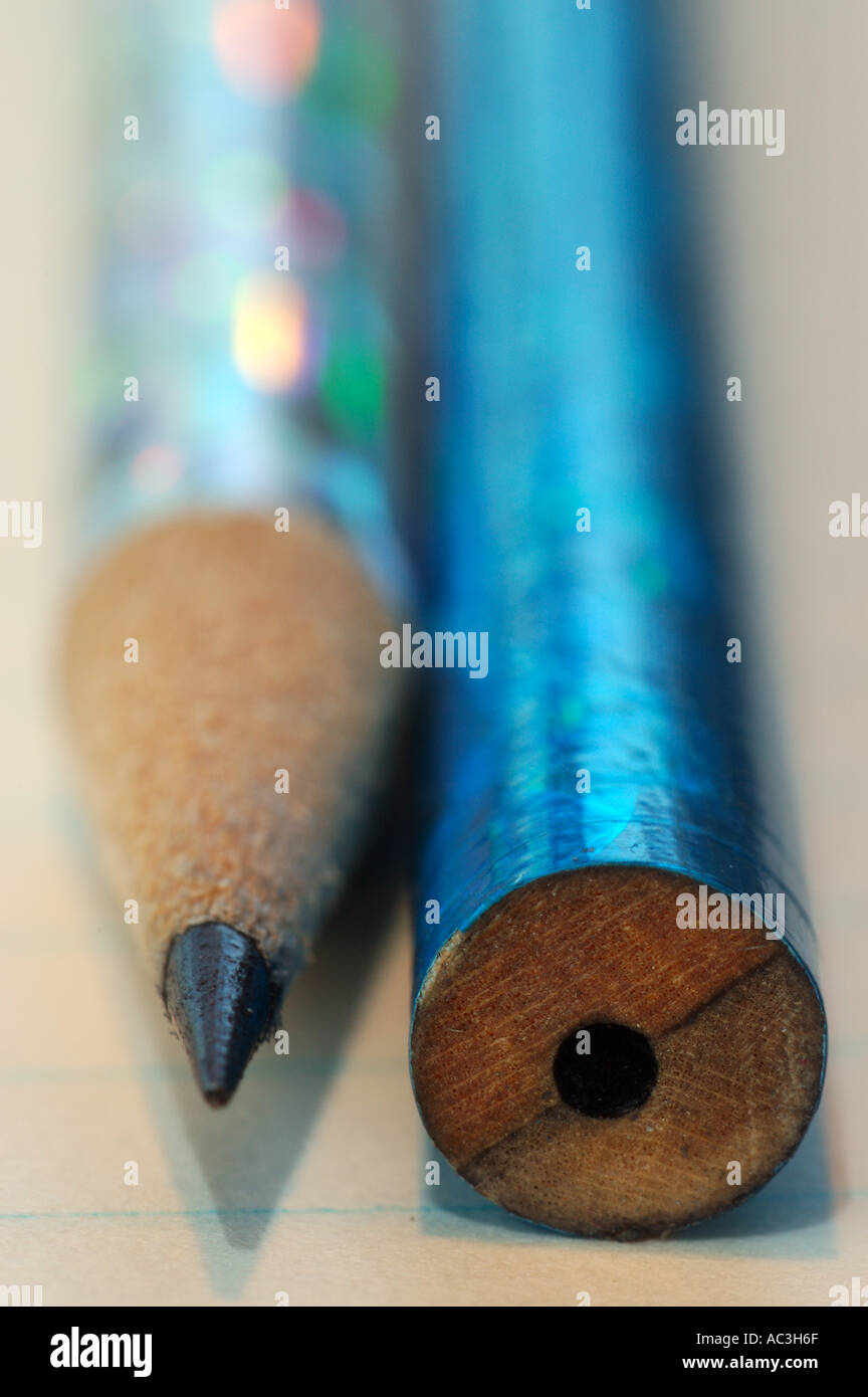 Two new blue pencils one sharpened Stock Photo - Alamy