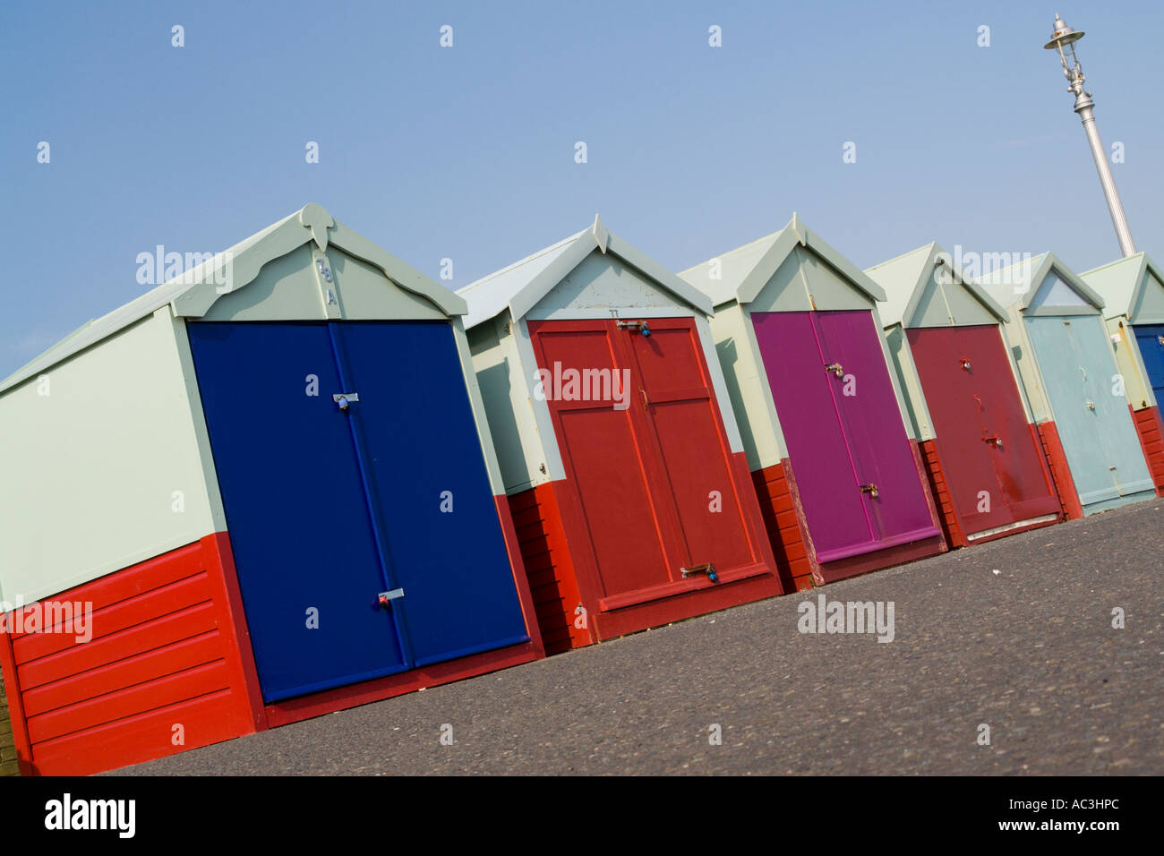 row of colourful brighton beach huts Stock Photo - Alamy