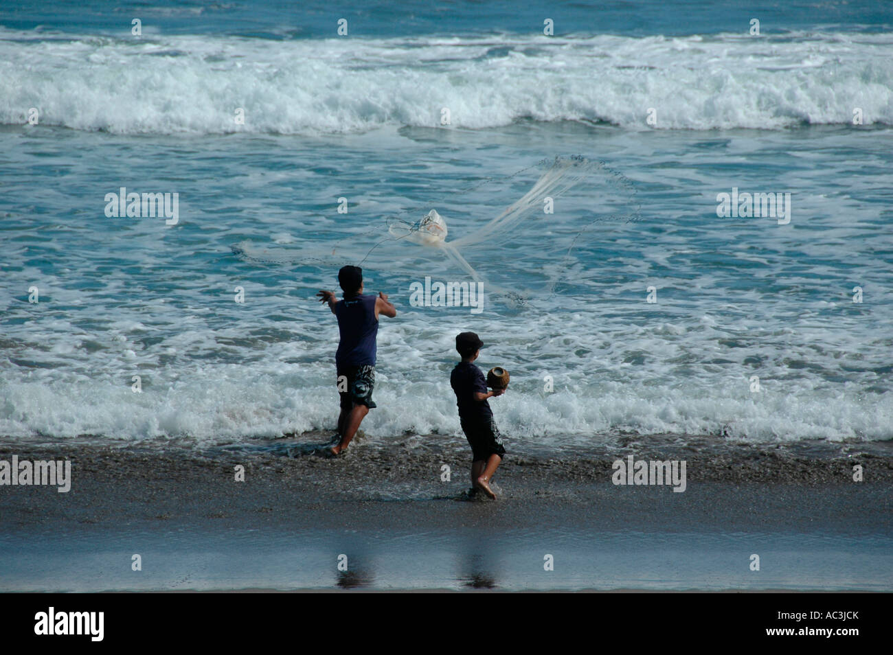 Bali Indonesia, Net fishermen Fishing from the beach of Seminyak Bali ...