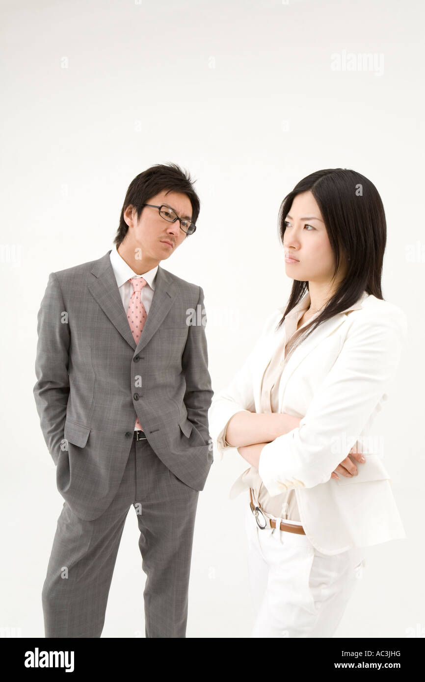 Two business people glaring at each other Stock Photo - Alamy