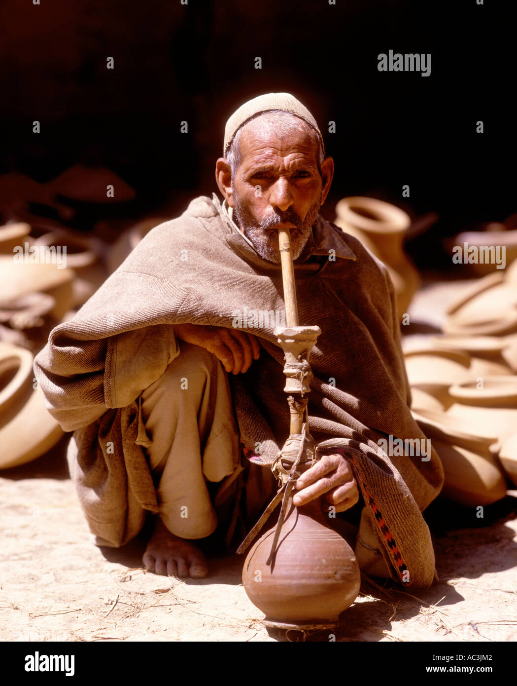 Old man smoking Hukka Stock Photo - Alamy