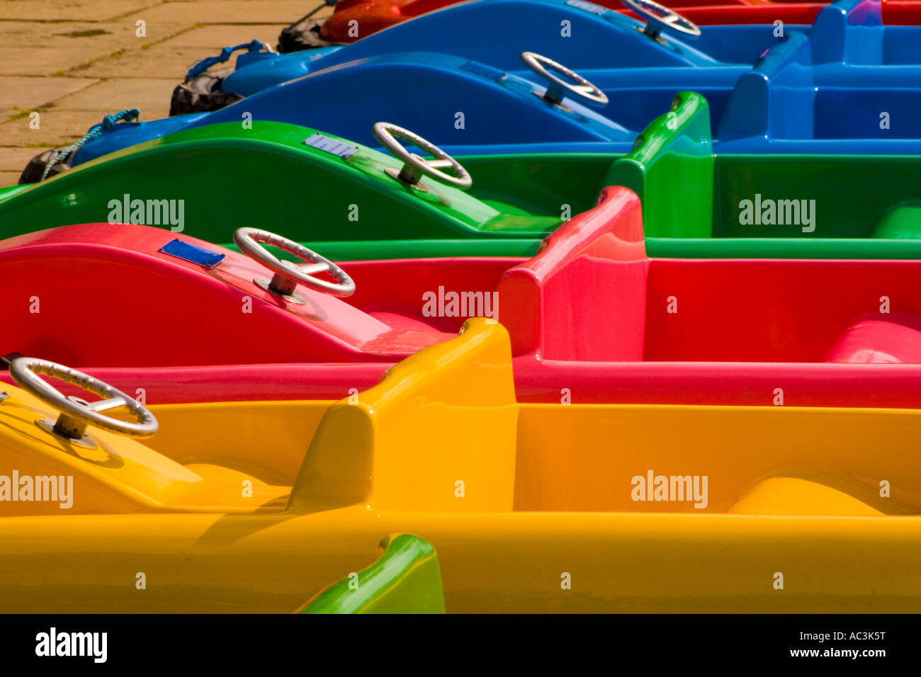 Line of brightly colored boats on the river Dee in Chester Stock Photo ...