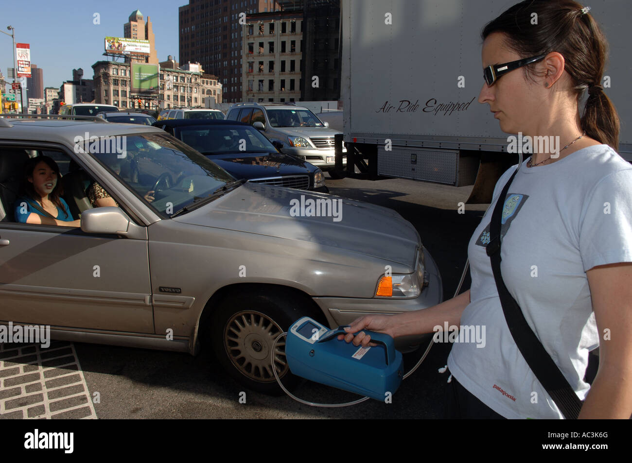 Environmental engineer measures air quality for air pollution in Queens ...