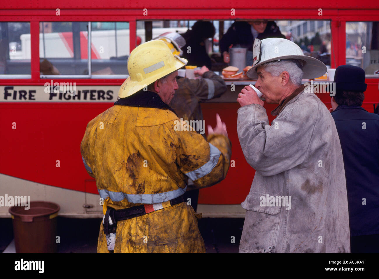 Firefighters / Firemen talking while taking a Coffee Break after ...