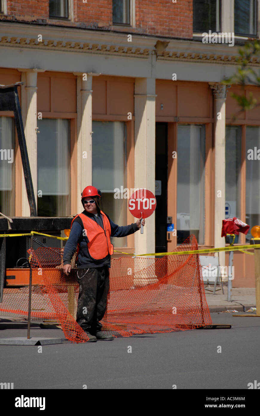 Directing traffic, stop sign Stock Photo - Alamy