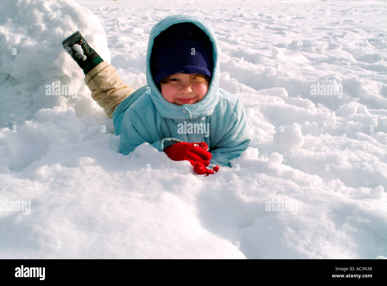 Girl playing in fresh snow hi-res stock photography and images - Alamy